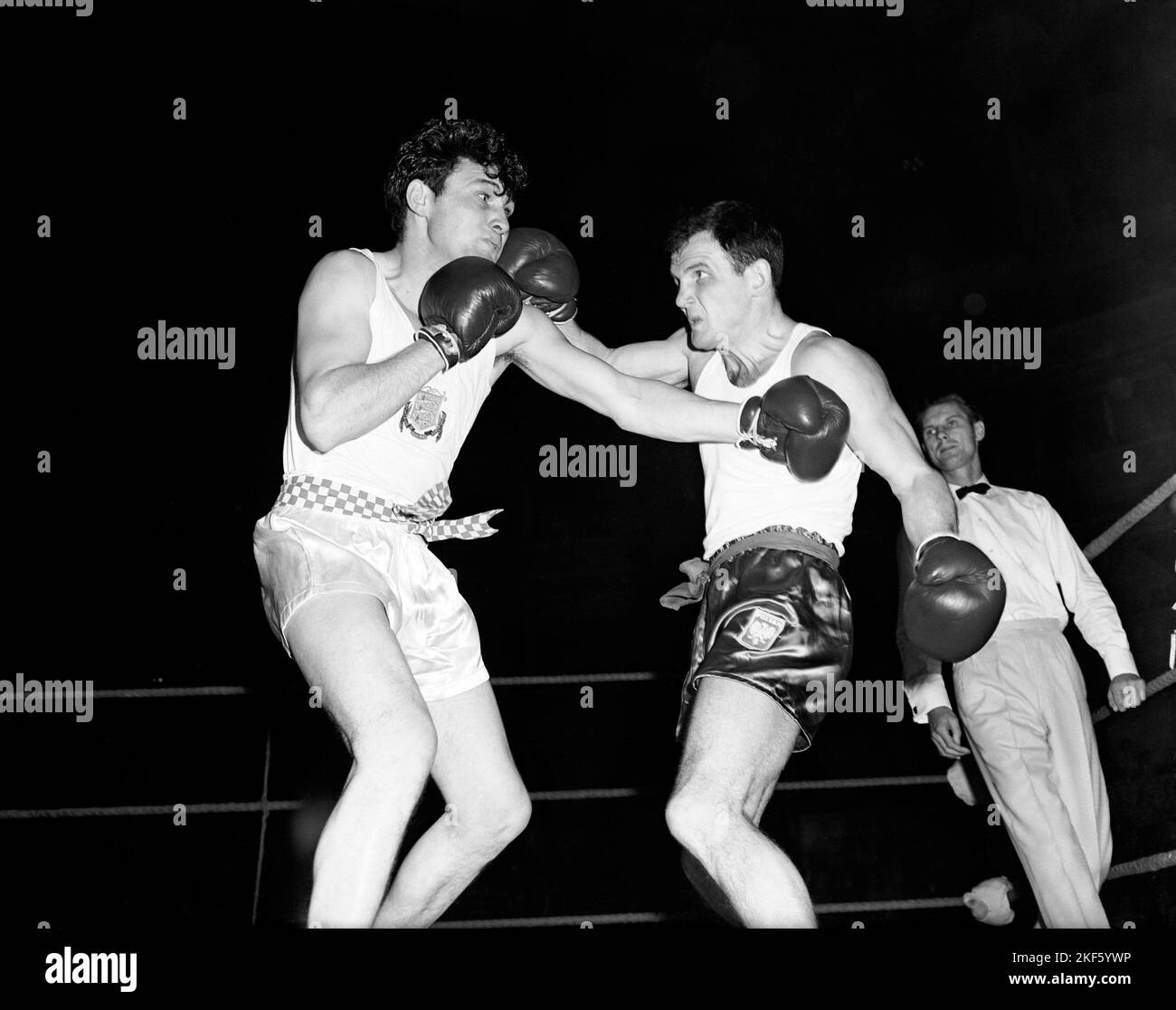 Poland's Jerzy Kulej (r) connects with a right to the jaw of England's ...