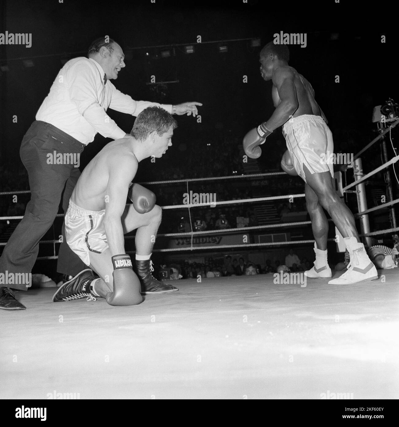Referee Harry Gibbs orders Errol Christie to his corner as Mark Kaylor ...