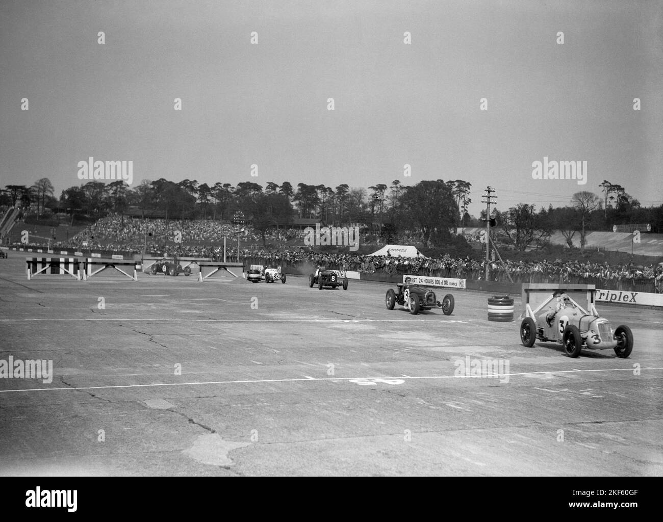 Cars coming through the S bend at Brooklands Stock Photo - Alamy