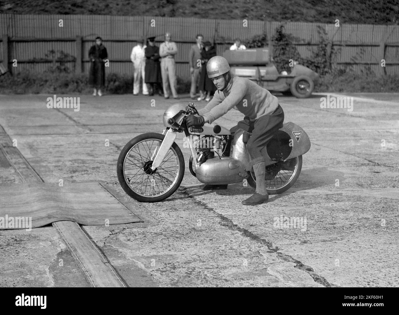Harry Nash on a New Imperial motorcycle attempting the 1 kilometre and 1 mile standing start ...