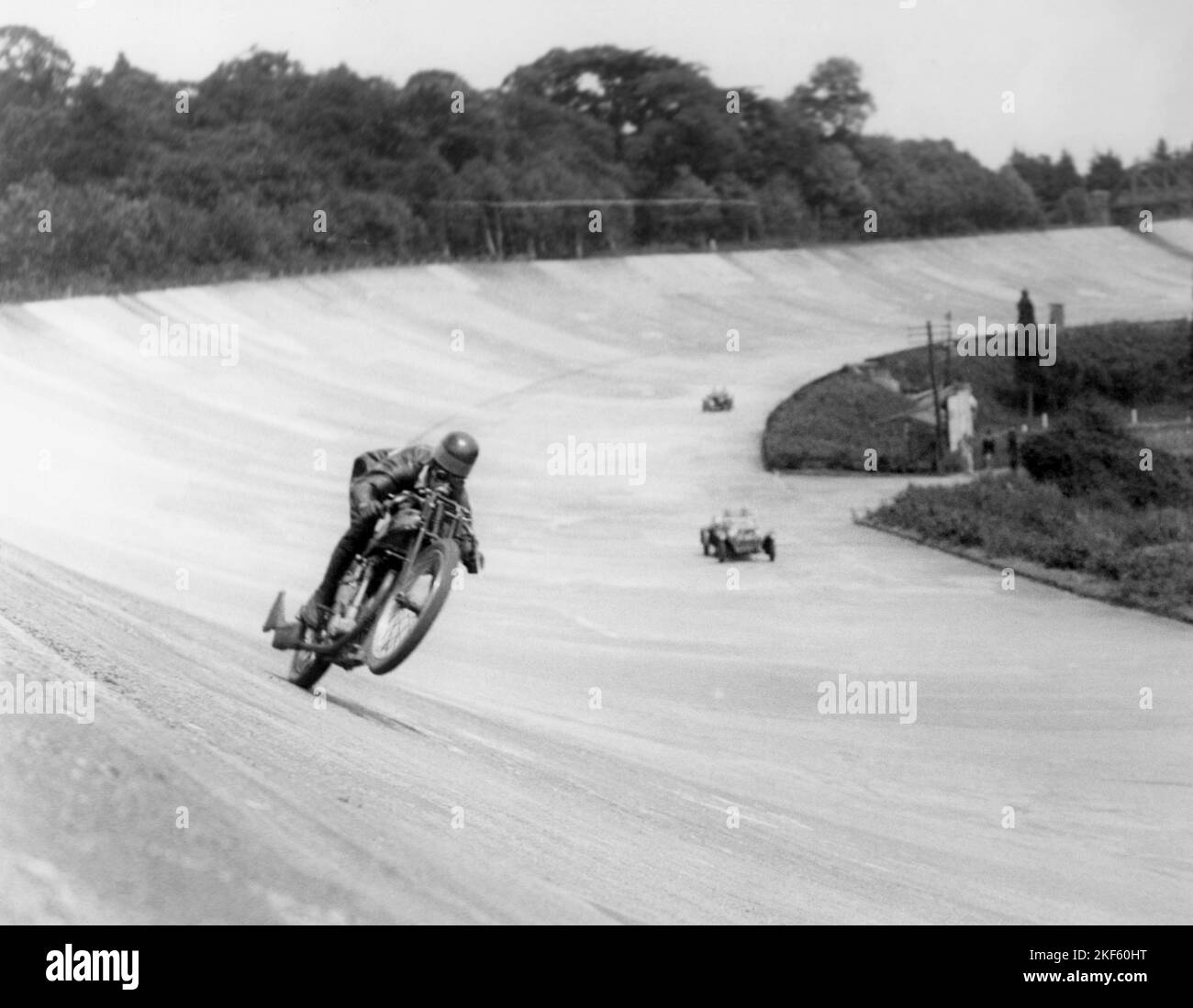 Noel Pope jumping the banking on a motorcycle at Brooklands Stock Photo ...