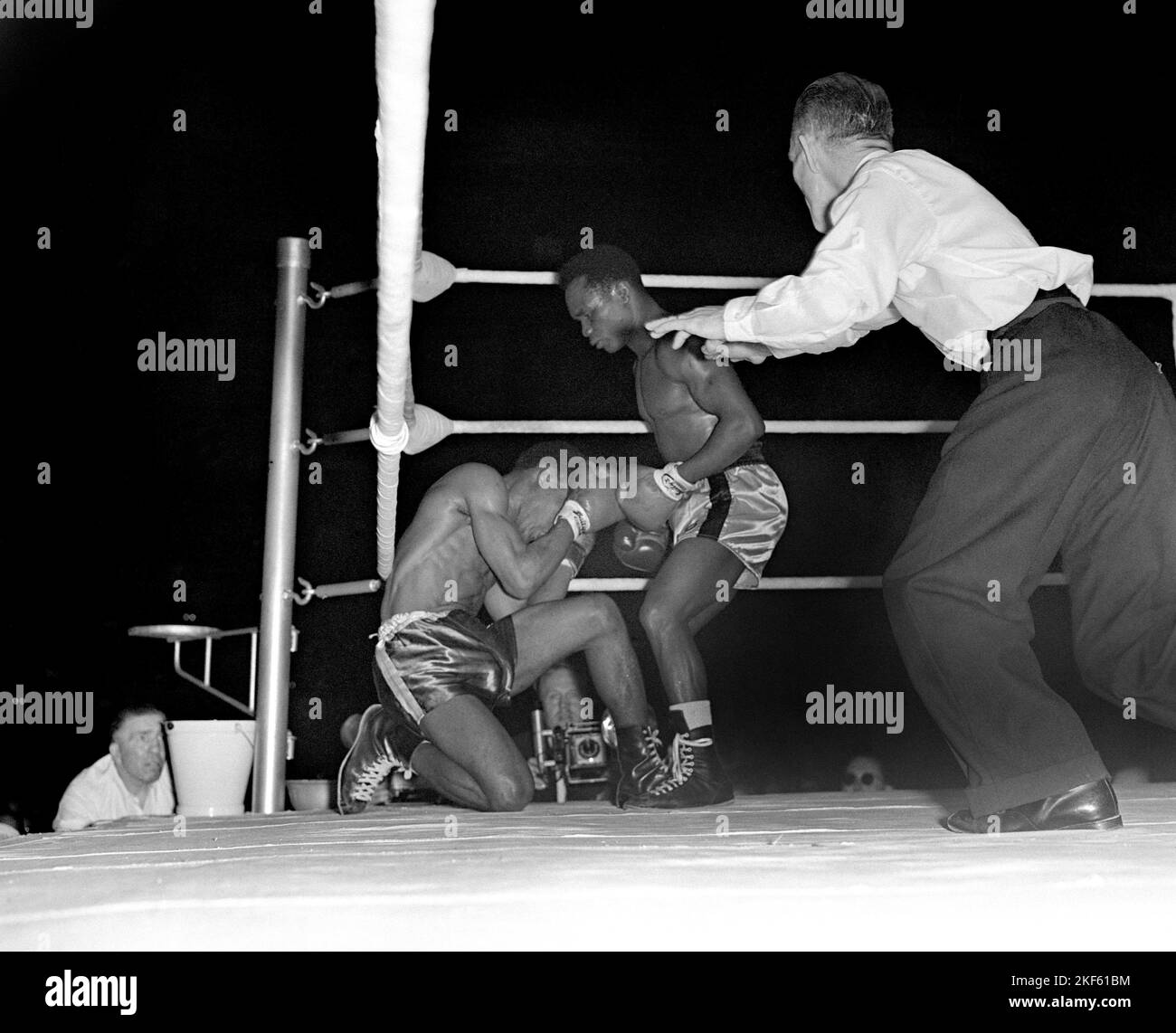 Jules Touan, from the Ivory Coast, drops to one knee under a barrage of ...
