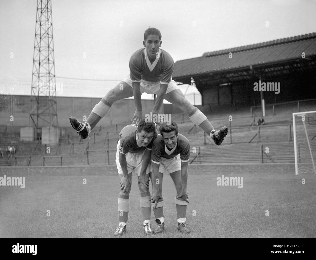 Dennis Jackson leap frogs over Barry Pierce, left, and Sammy Wilson ...