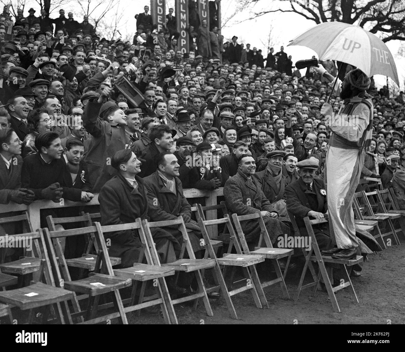 The Colchester supporter performs for the crowd Stock Photo - Alamy
