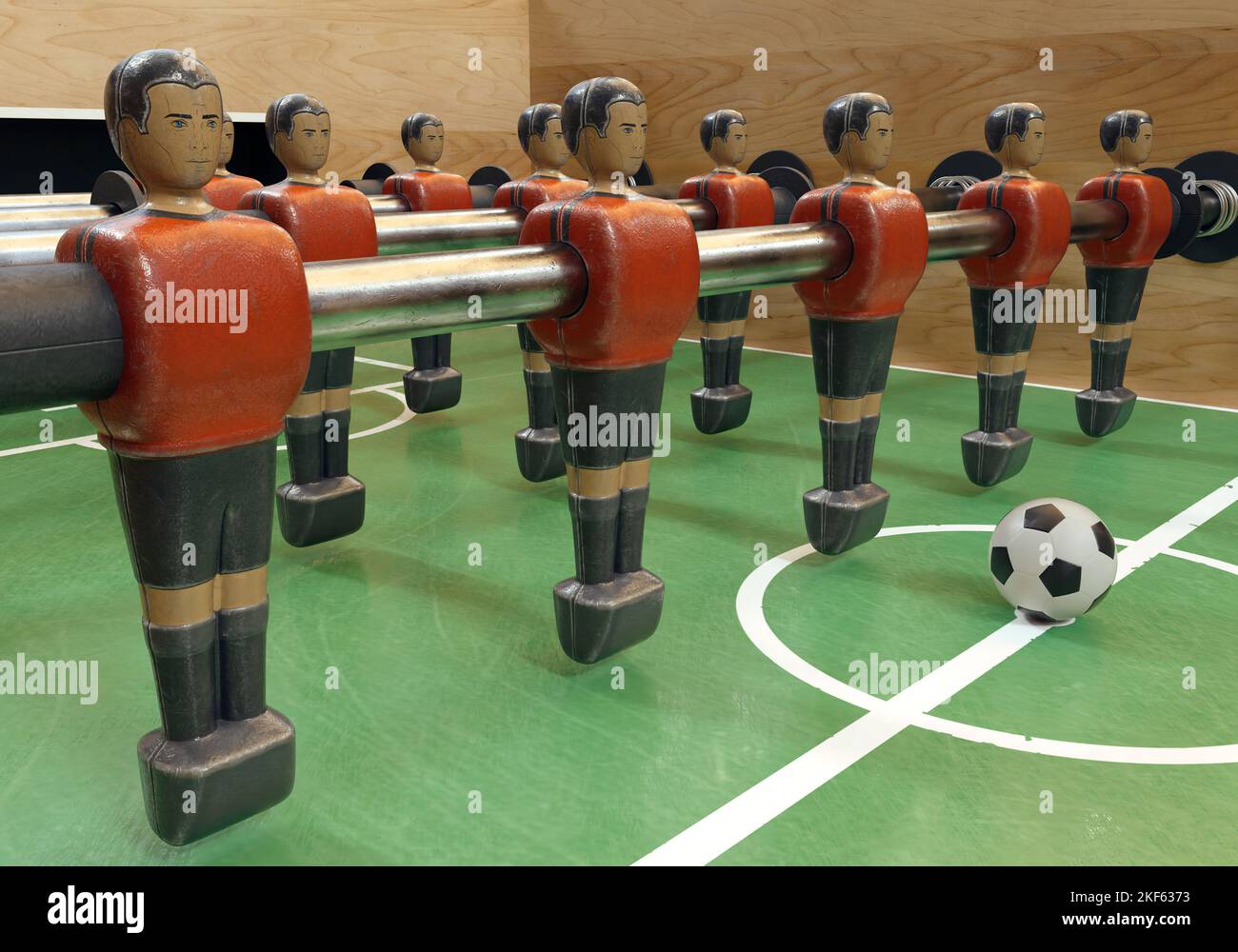 One side of a vintage foosball or table football table with worn metal ...