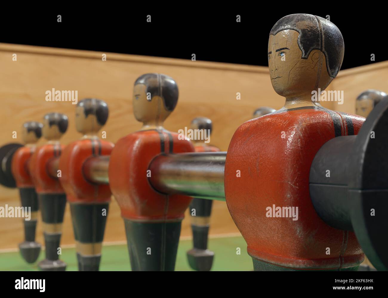 One side of a vintage foosball or table football table with worn metal ...