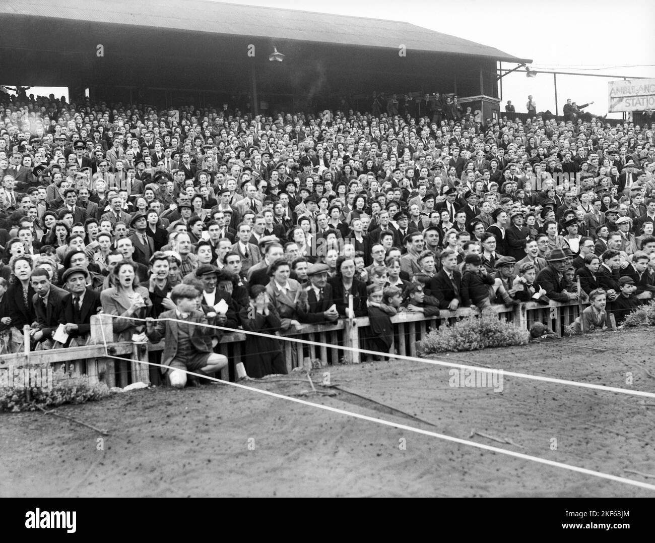 A section of the crowd watching the race at the New Cross speedway ...