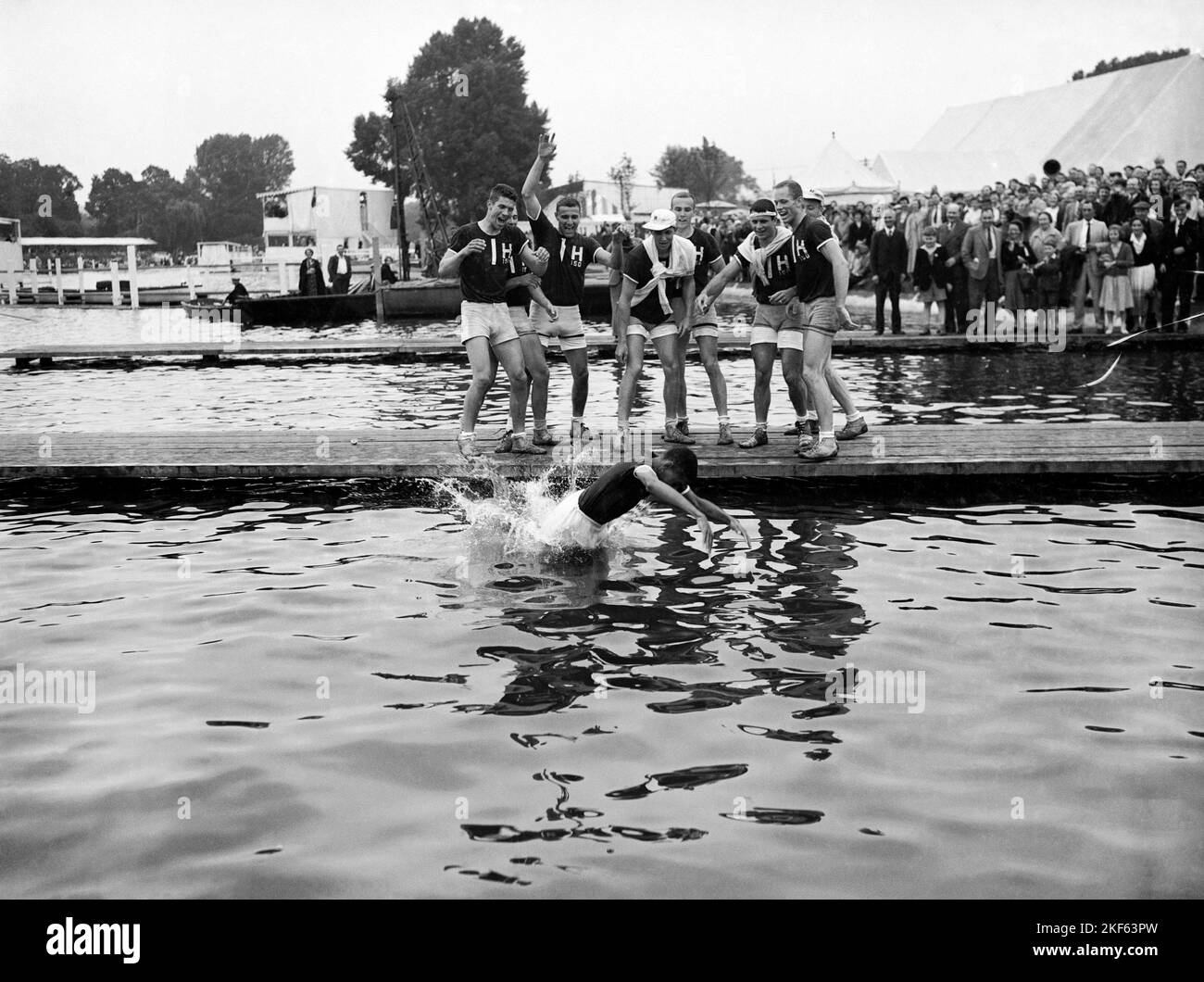 The Harvard University USA crew duck their cox after winning the Thames ...