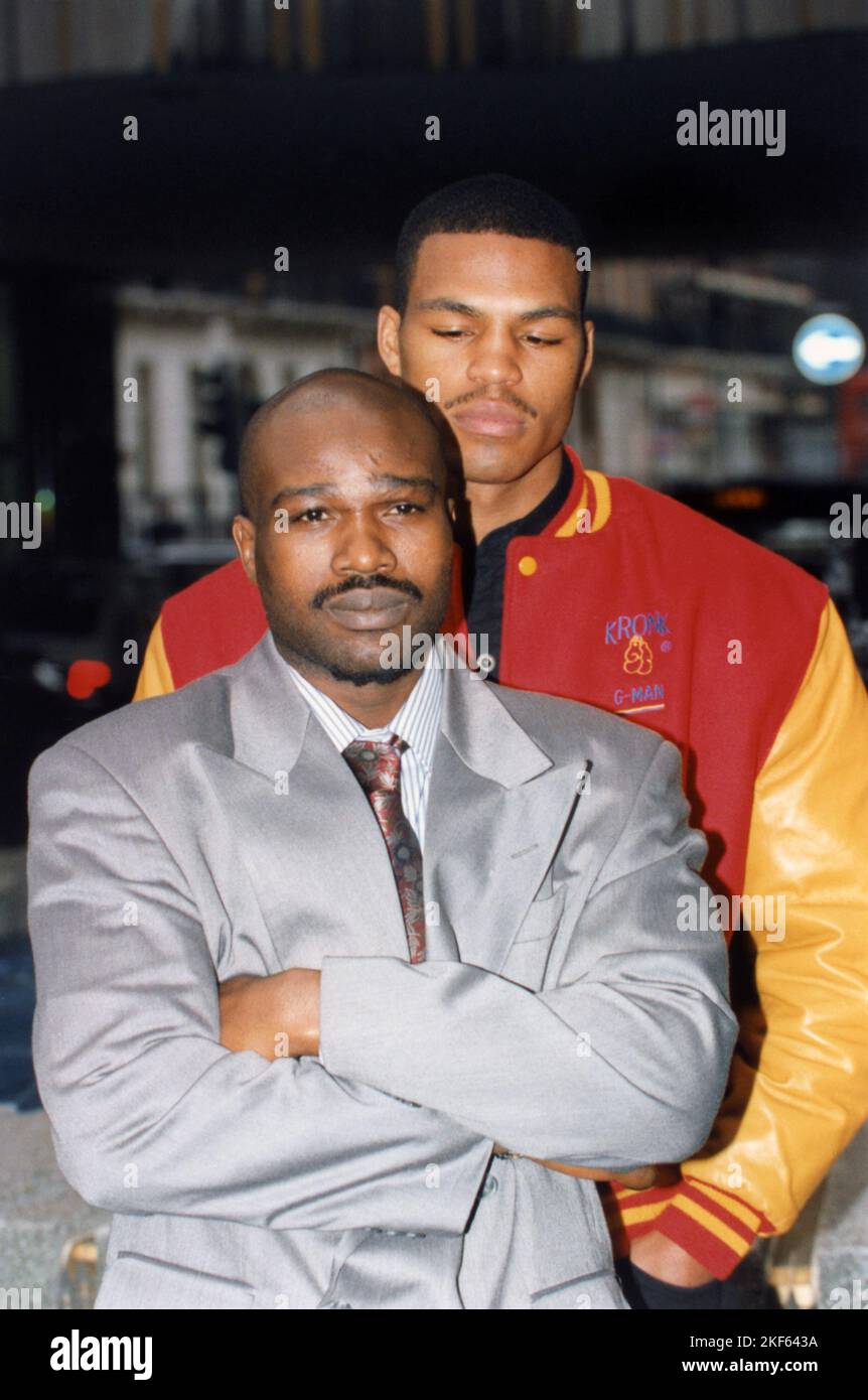Ugandan boxer John "The Beast" Mugabi (in grey suit) poses with his ...