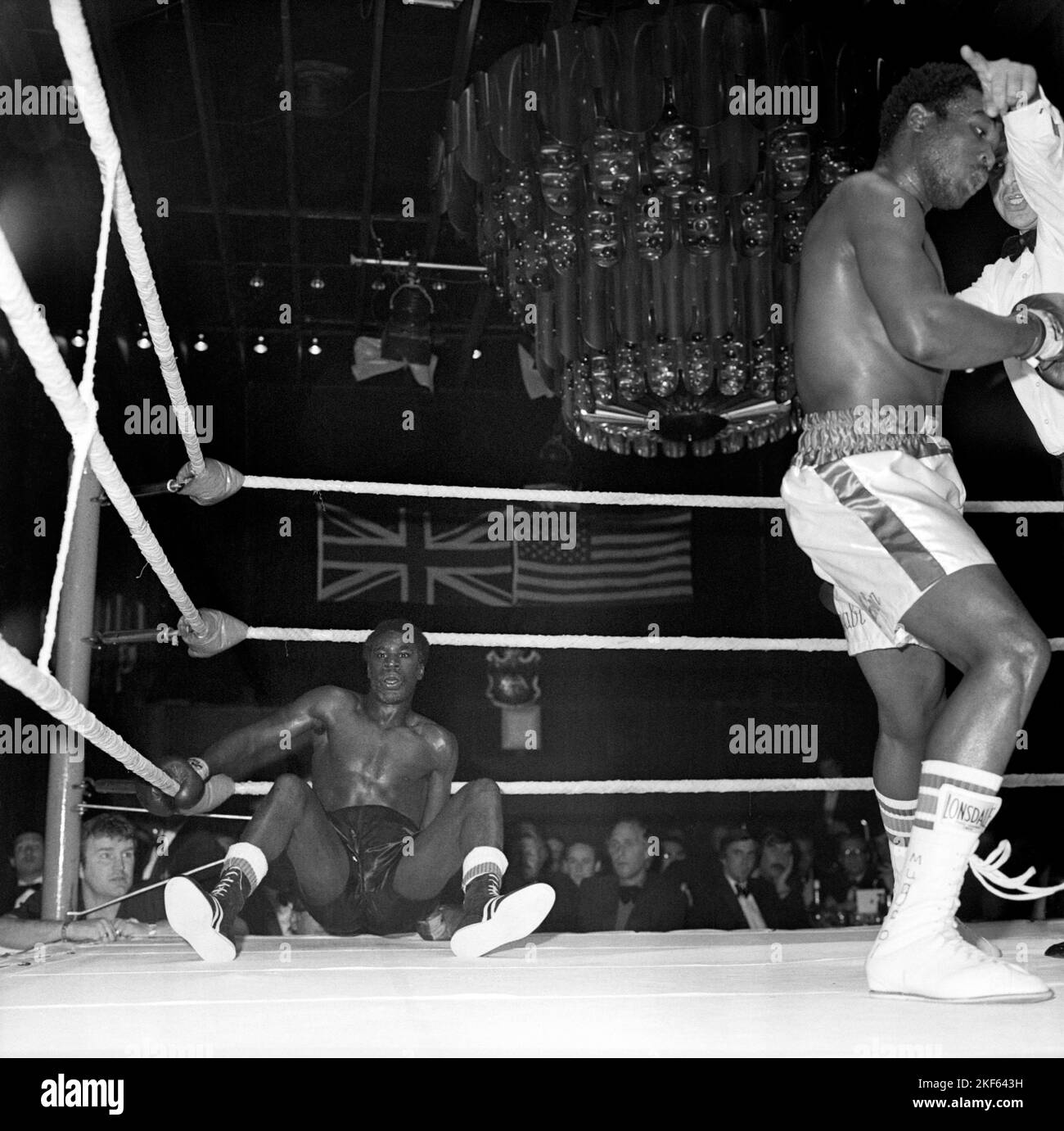 Ugandan boxer John "The Beast" Mugabi is sent to his corner after ...