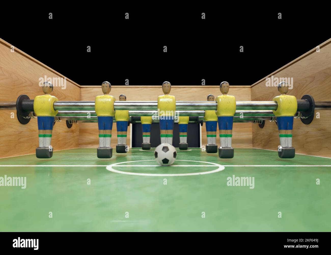 One side of a vintage foosball or table football table with worn metal ...