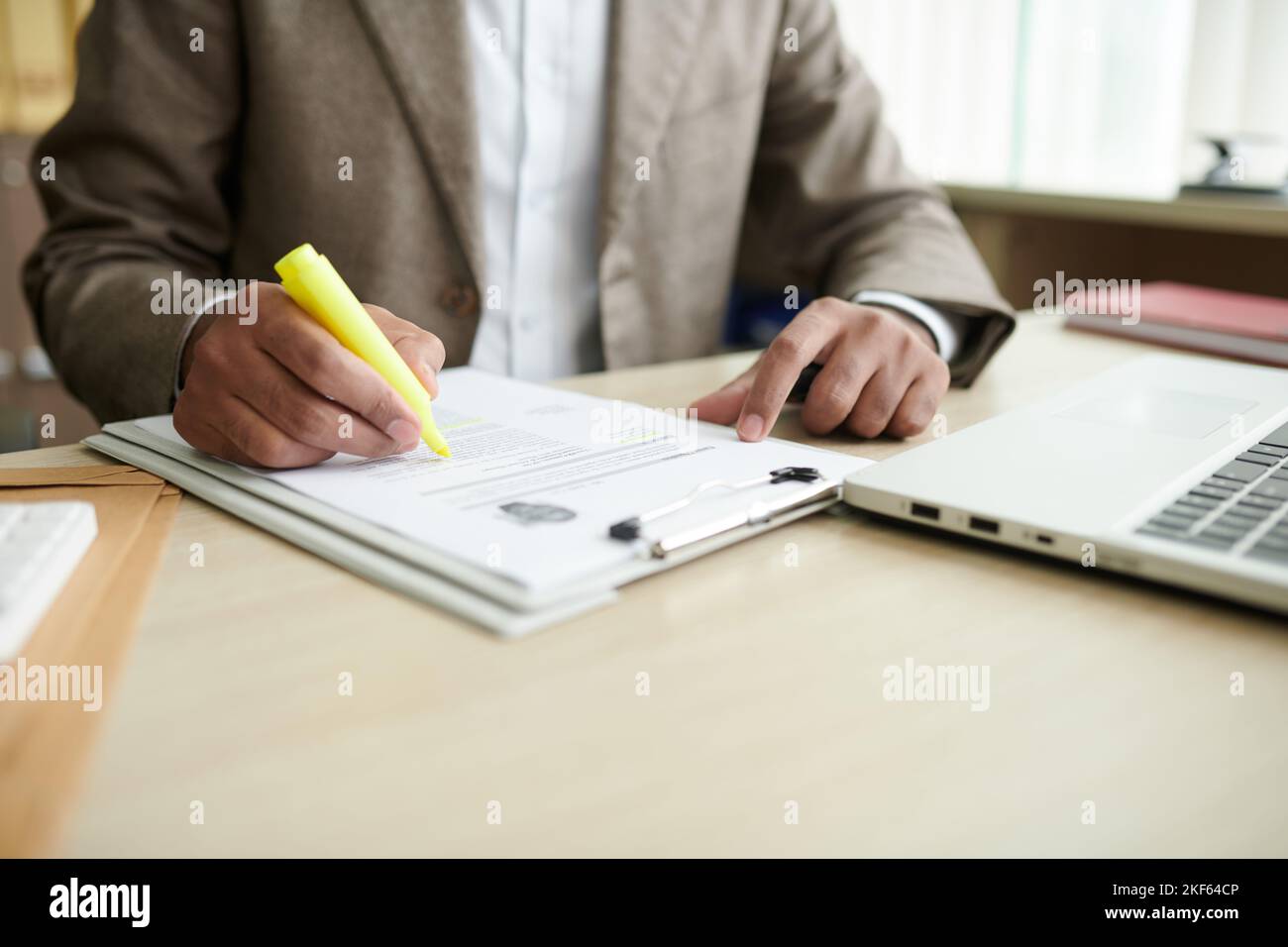 Businessman highlighting important information in cv of job application ...