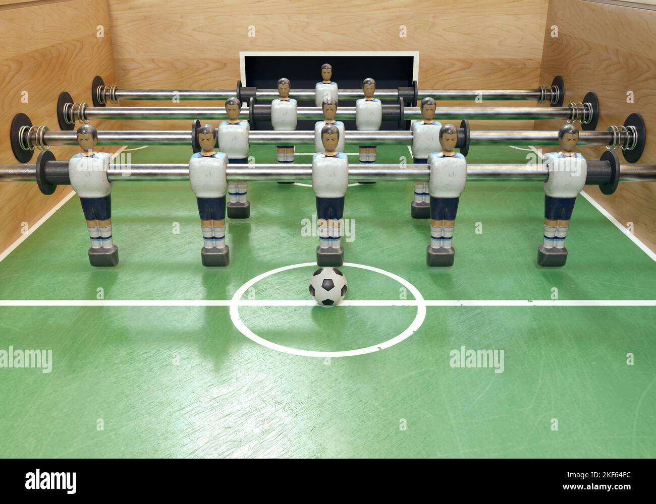 One side of a vintage foosball or table football table with worn metal ...