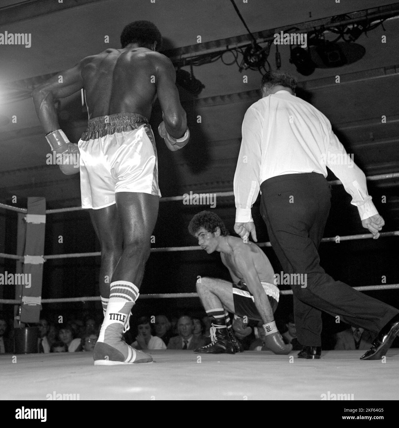 Clinton McKenzie, left, looks on at the knocked down Steve Early ...