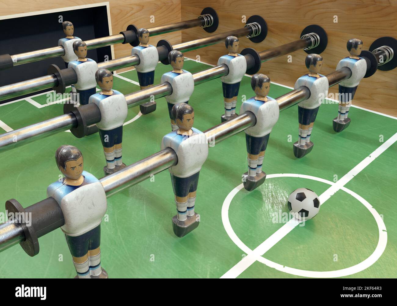 One side of a vintage foosball or table football table with worn metal ...