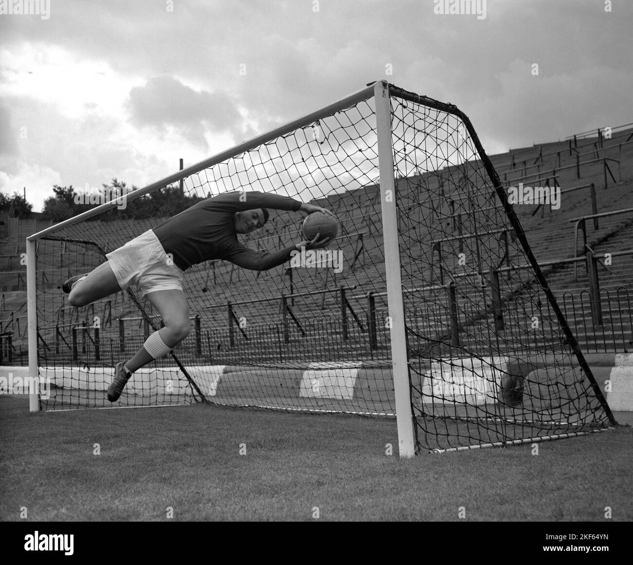 Charlton goalkeeper Willie Duff makes an acrobatic save during training ...