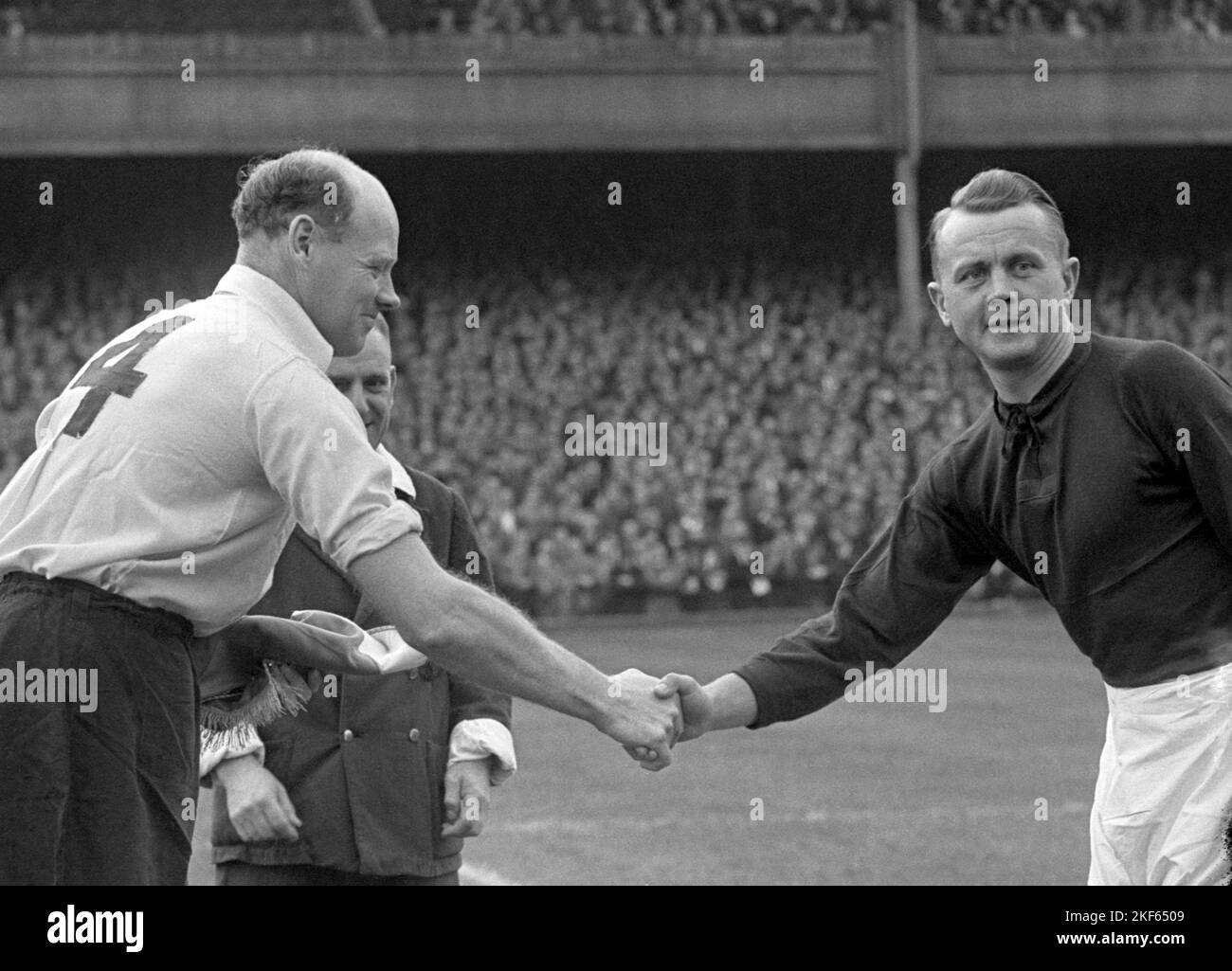 Arsenal Captain George Male (l) shakes hands with Czechoslovakia player ...