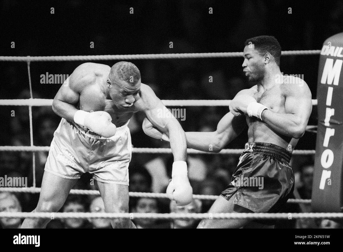 British Heavyweight Champion Gary Mason (l) gets caught on the arm by ...