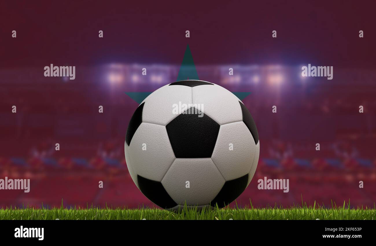 Soccer football ball on a grass pitch in front of stadium lights and ...