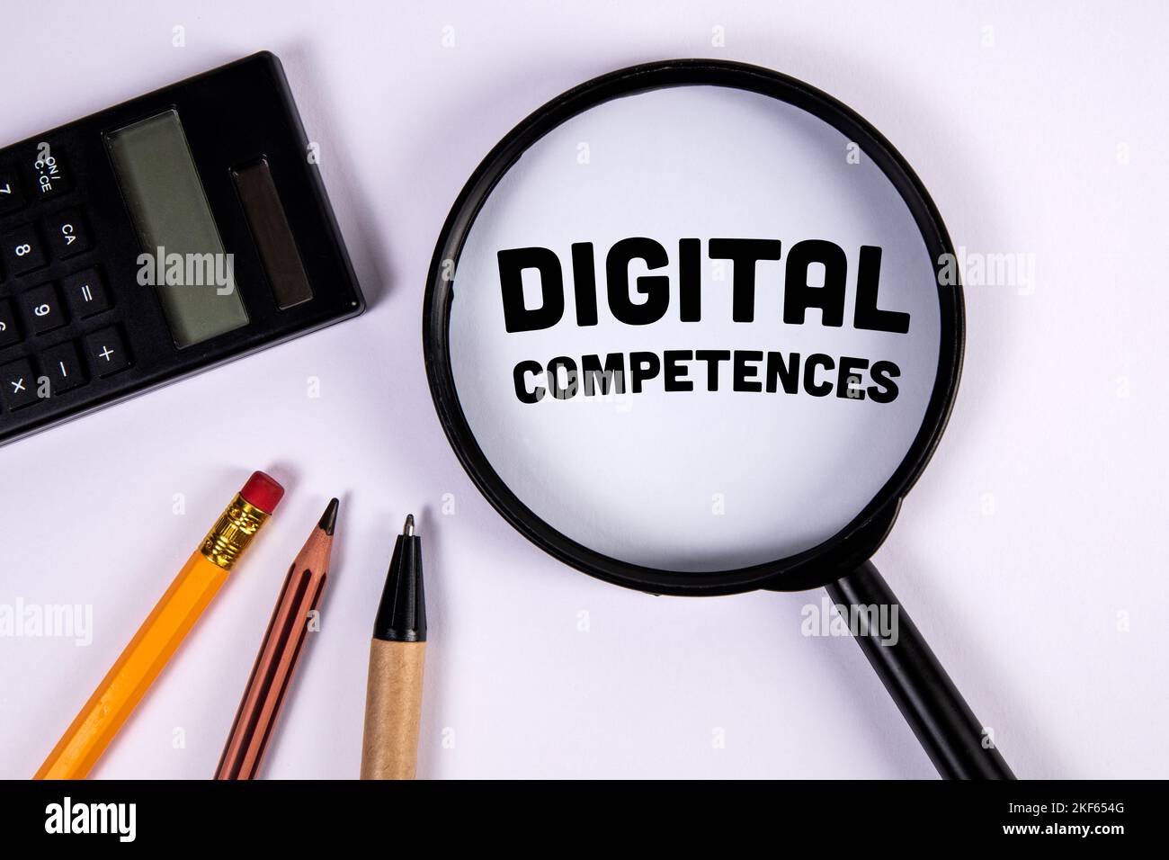Digital Competences. Magnifying glass and stationery on a white background Stock Photo - Alamy