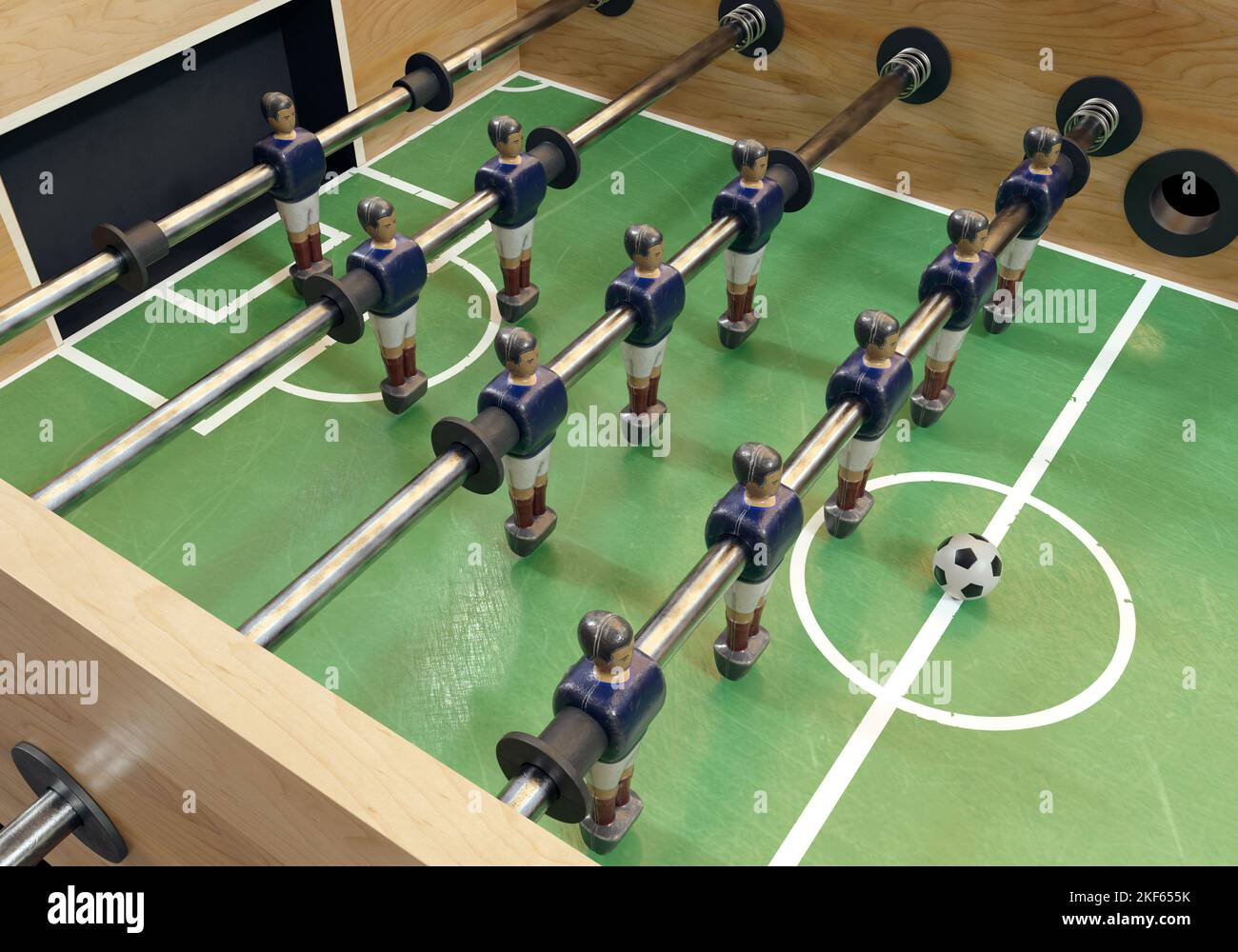 One side of a vintage foosball or table football table with worn metal ...