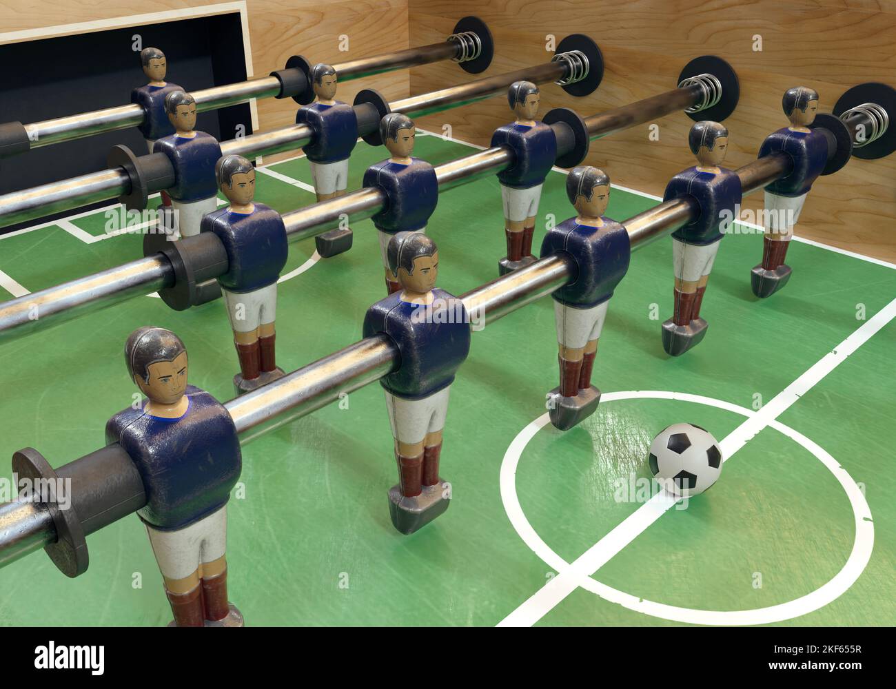 One side of a vintage foosball or table football table with worn metal ...