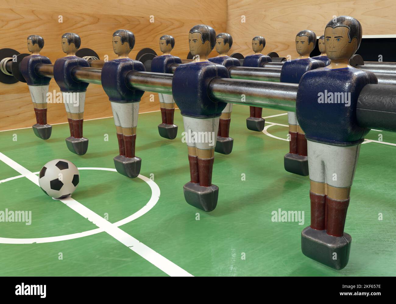 One side of a vintage foosball or table football table with worn metal ...