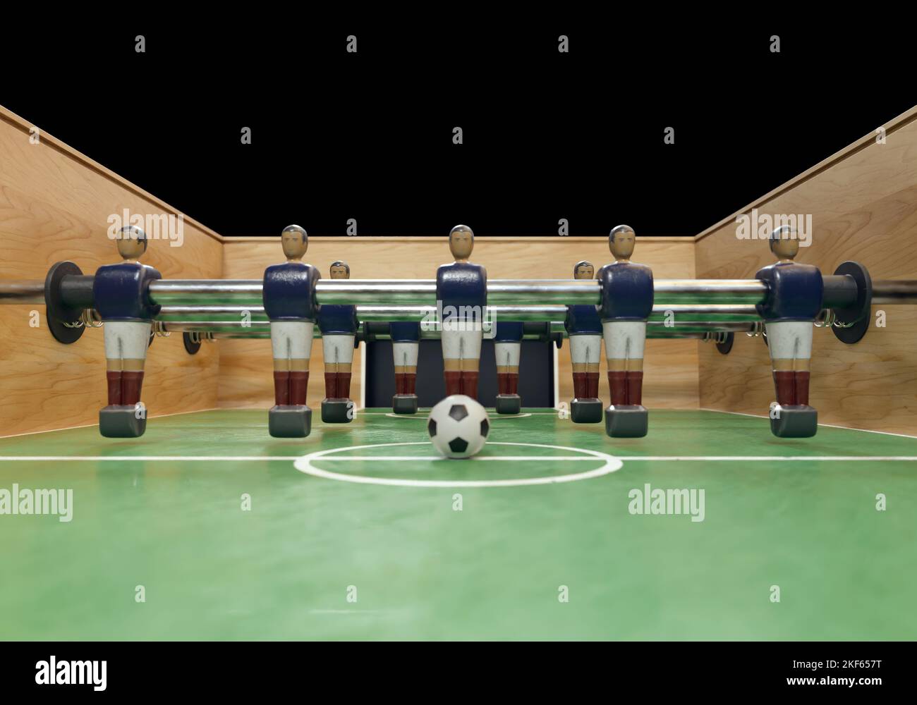 One side of a vintage foosball or table football table with worn metal ...