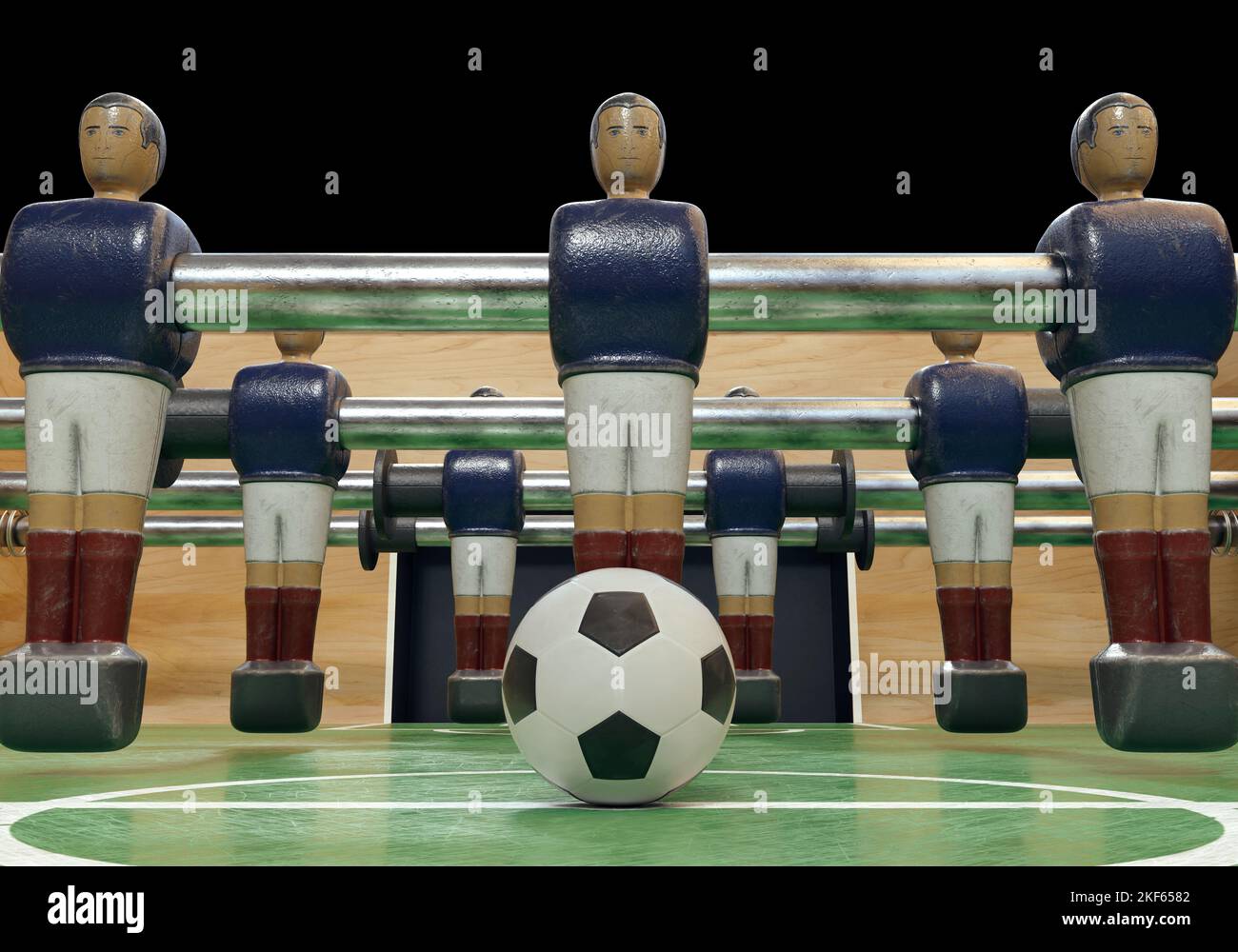 One side of a vintage foosball or table football table with worn metal ...