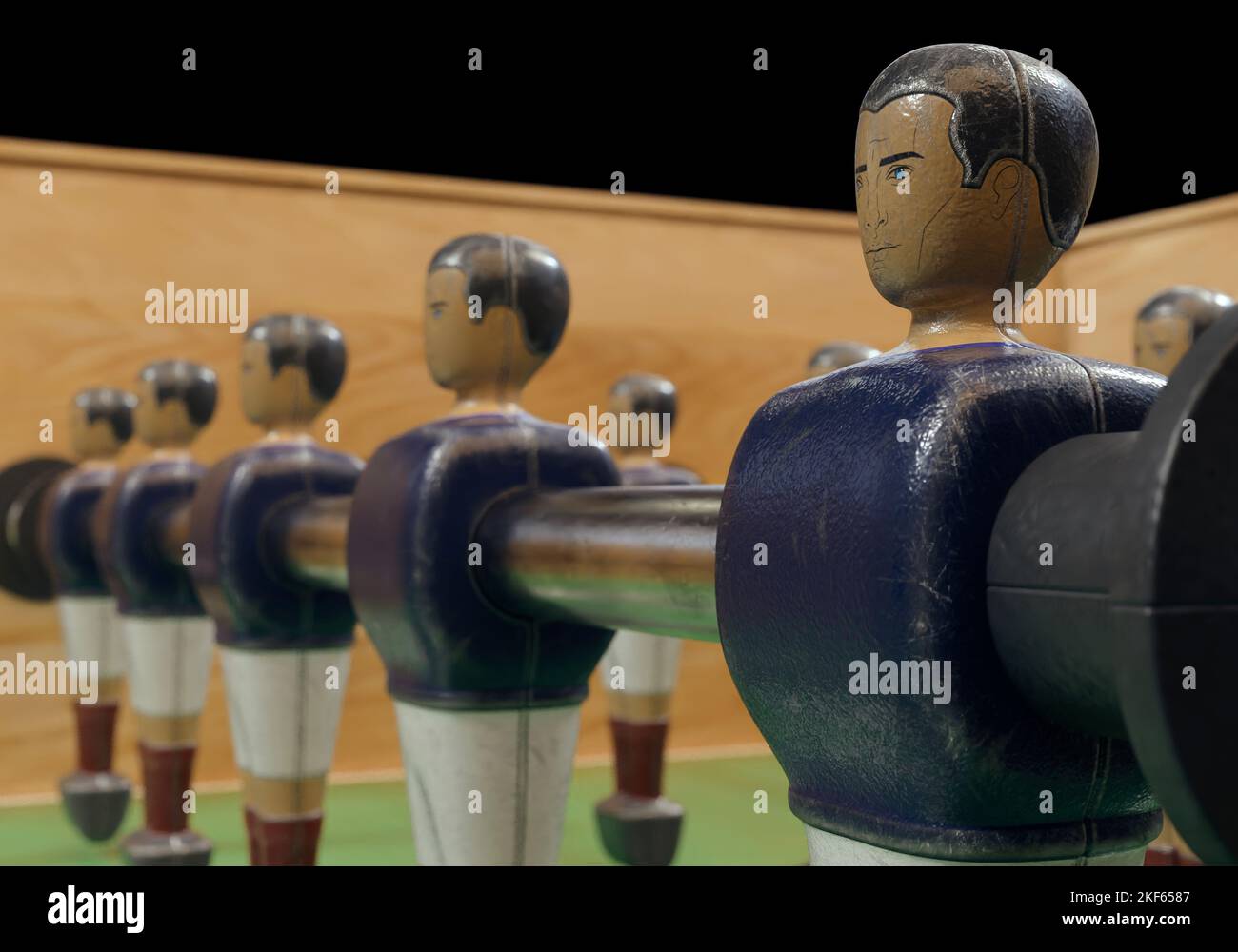 One side of a vintage foosball or table football table with worn metal ...