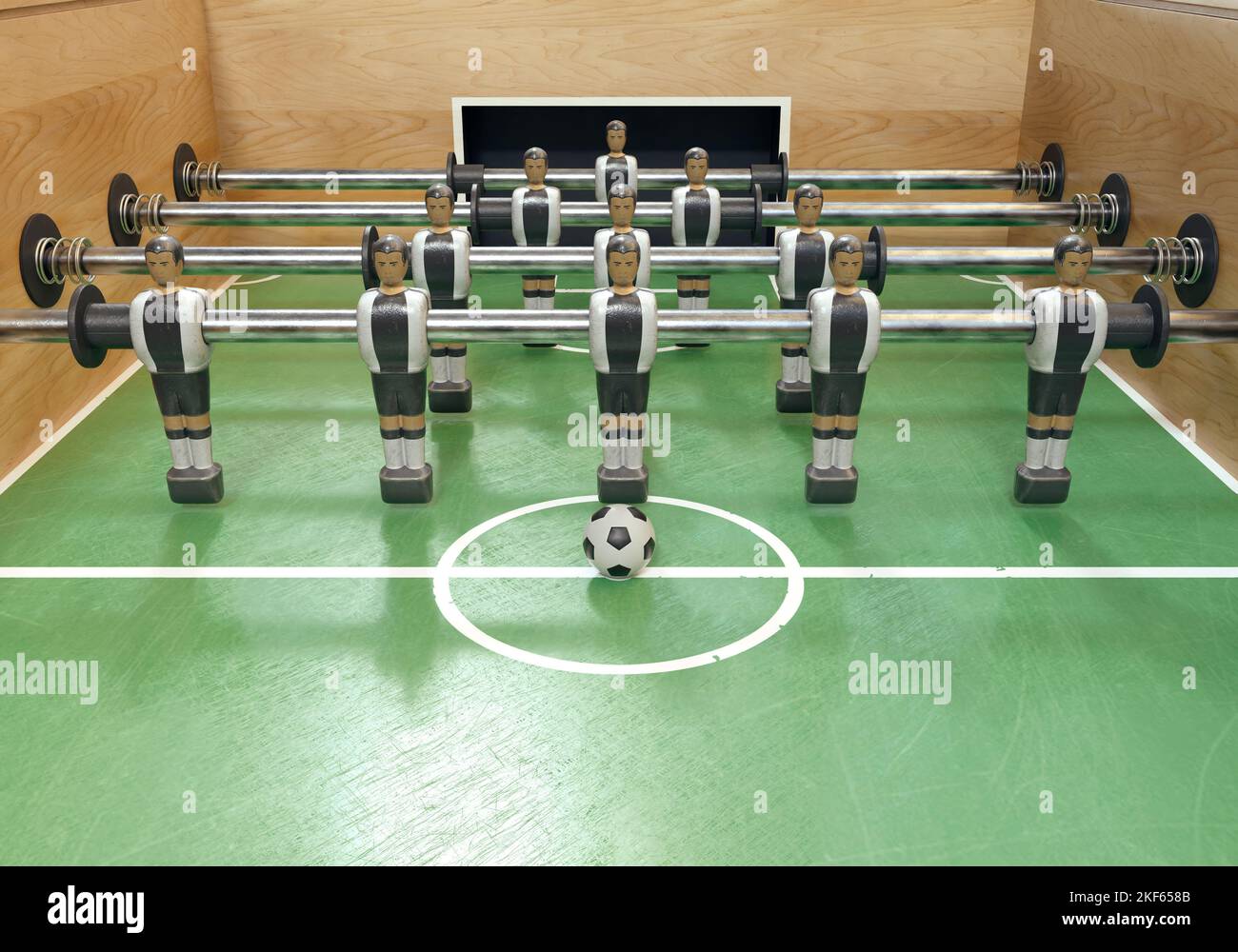 One side of a vintage foosball or table football table with worn metal ...