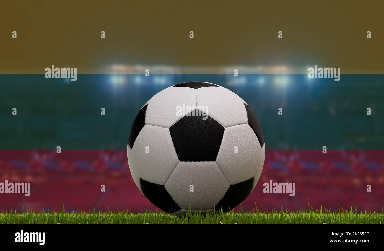 Soccer football ball on a grass pitch in front of stadium lights and ...