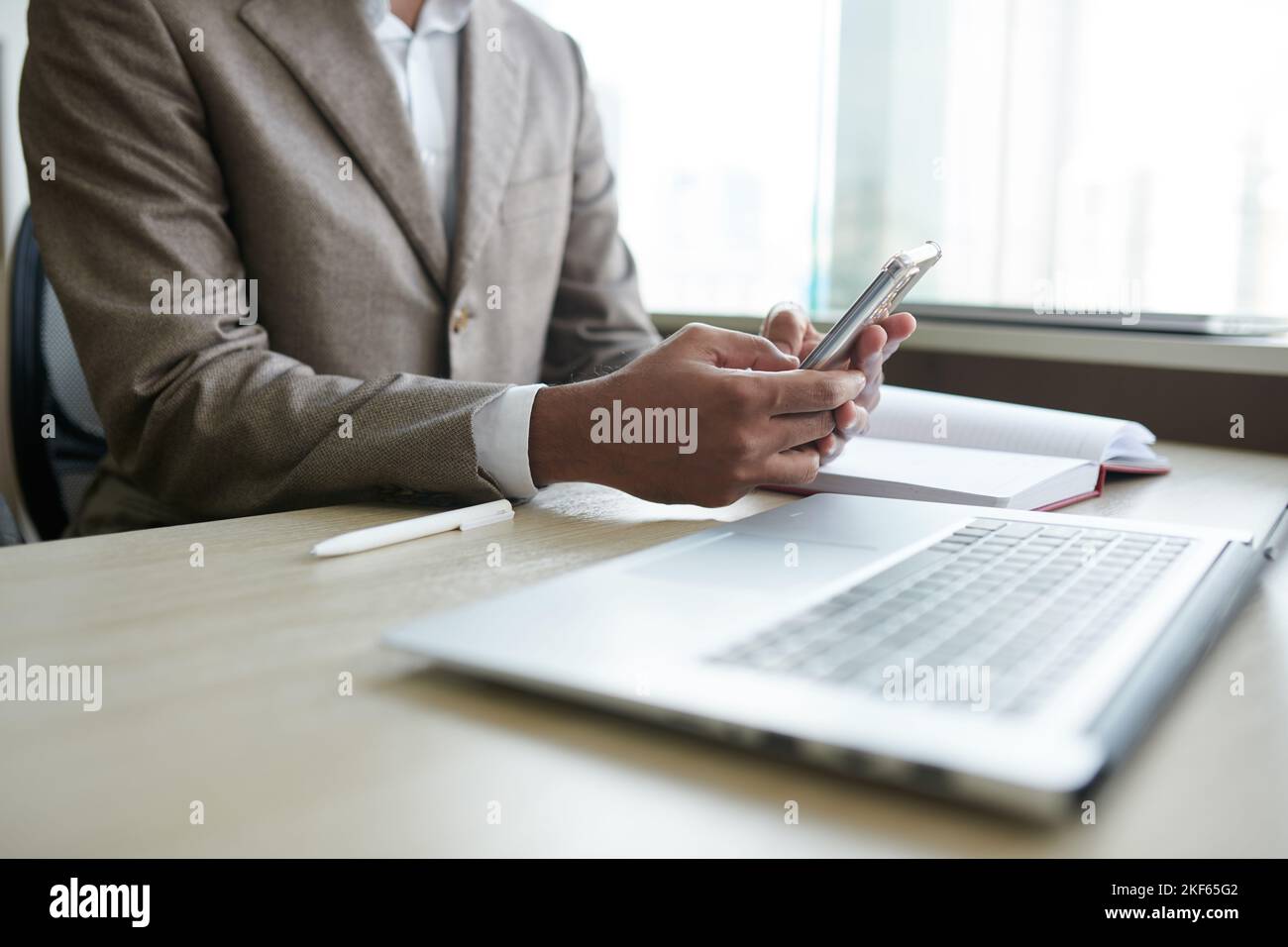 Cropped image of businessman checking text messages in smartphone Stock ...