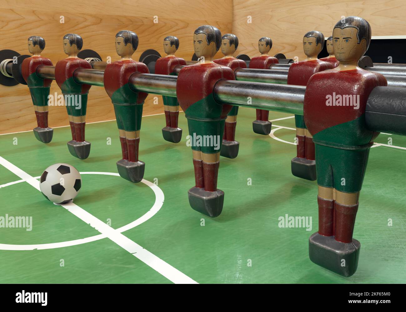 One side of a vintage foosball or table football table with worn metal ...
