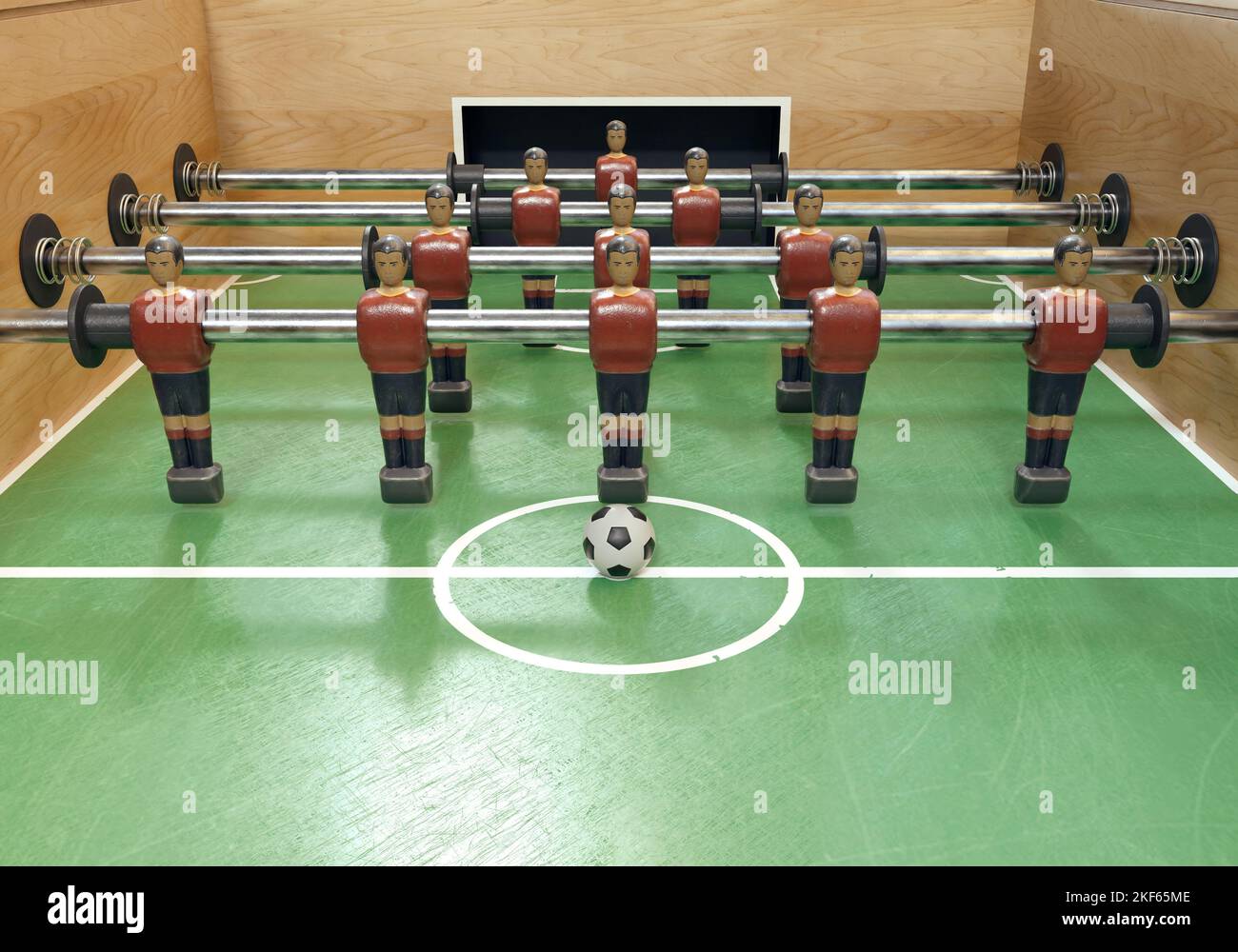 One side of a vintage foosball or table football table with worn metal ...