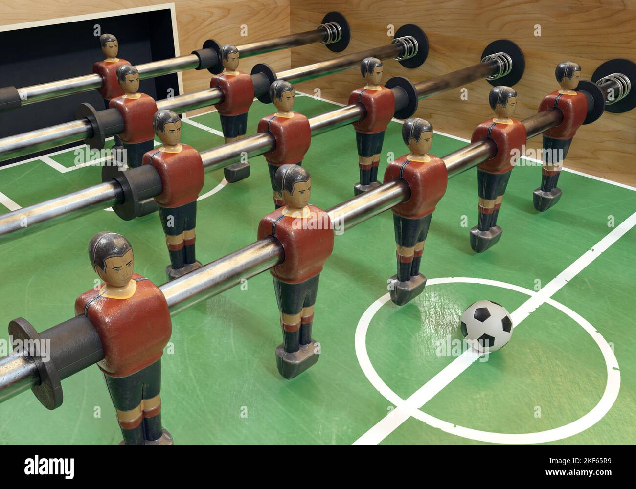 One side of a vintage foosball or table football table with worn metal ...