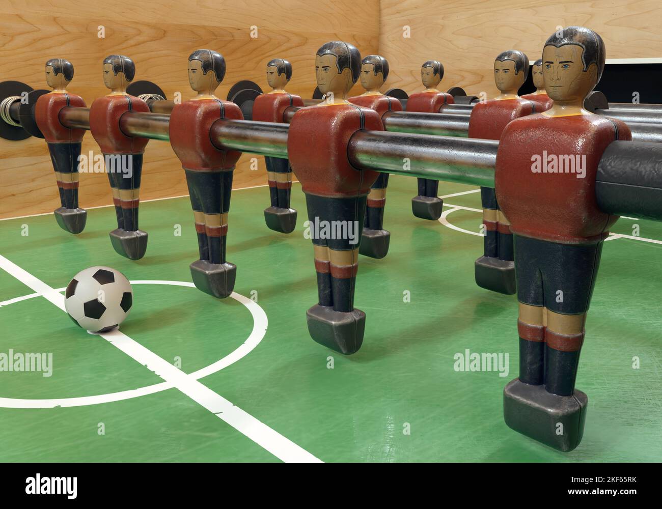 One side of a vintage foosball or table football table with worn metal ...