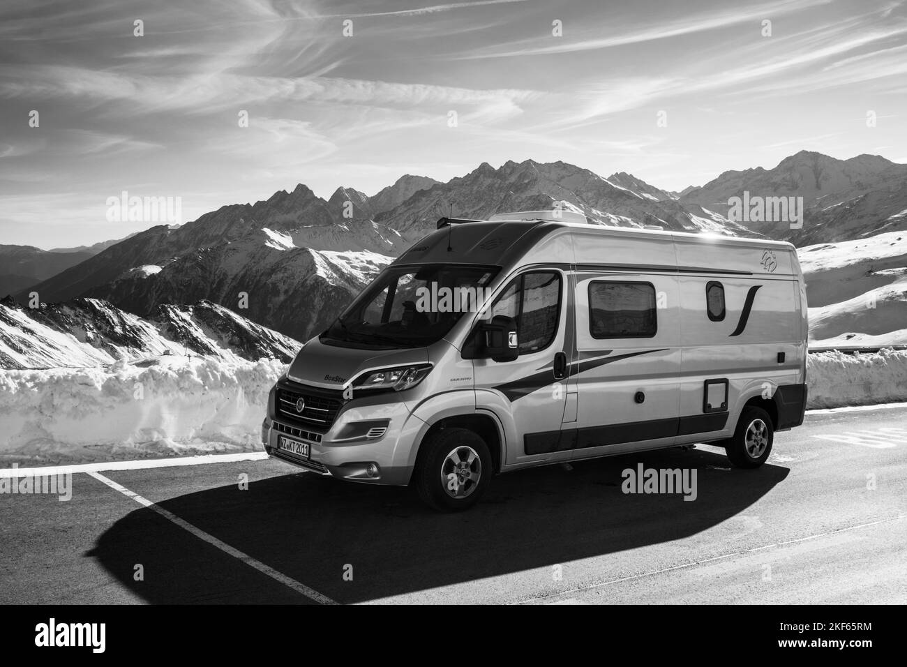 panoramic view of camper van against snowcapped mountain in Austria ...