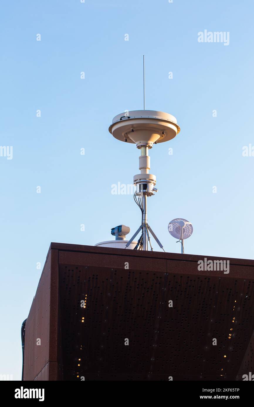 Disk shape communication tower with antenna on roof, mass surveillance ...