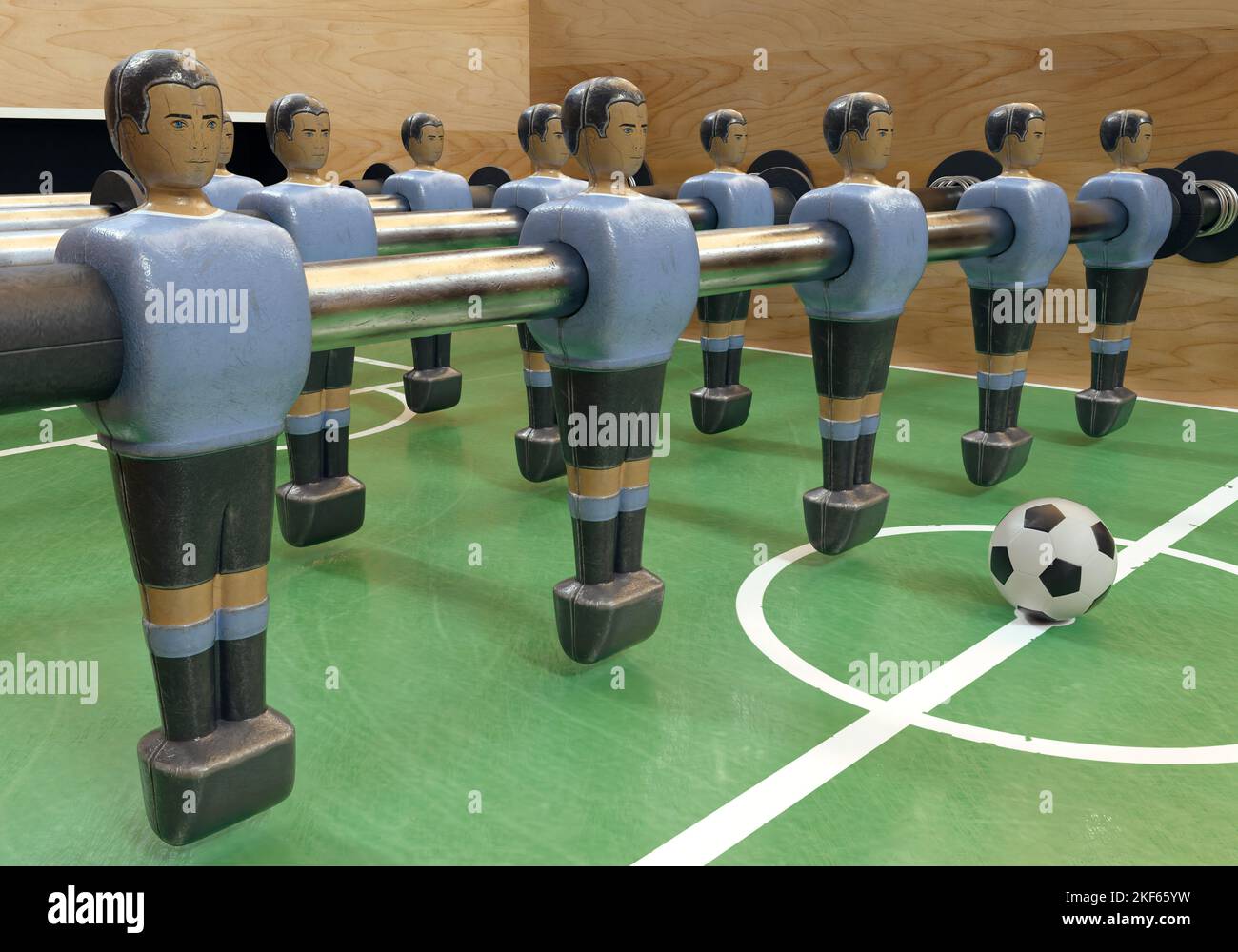 One side of a vintage foosball or table football table with worn metal ...