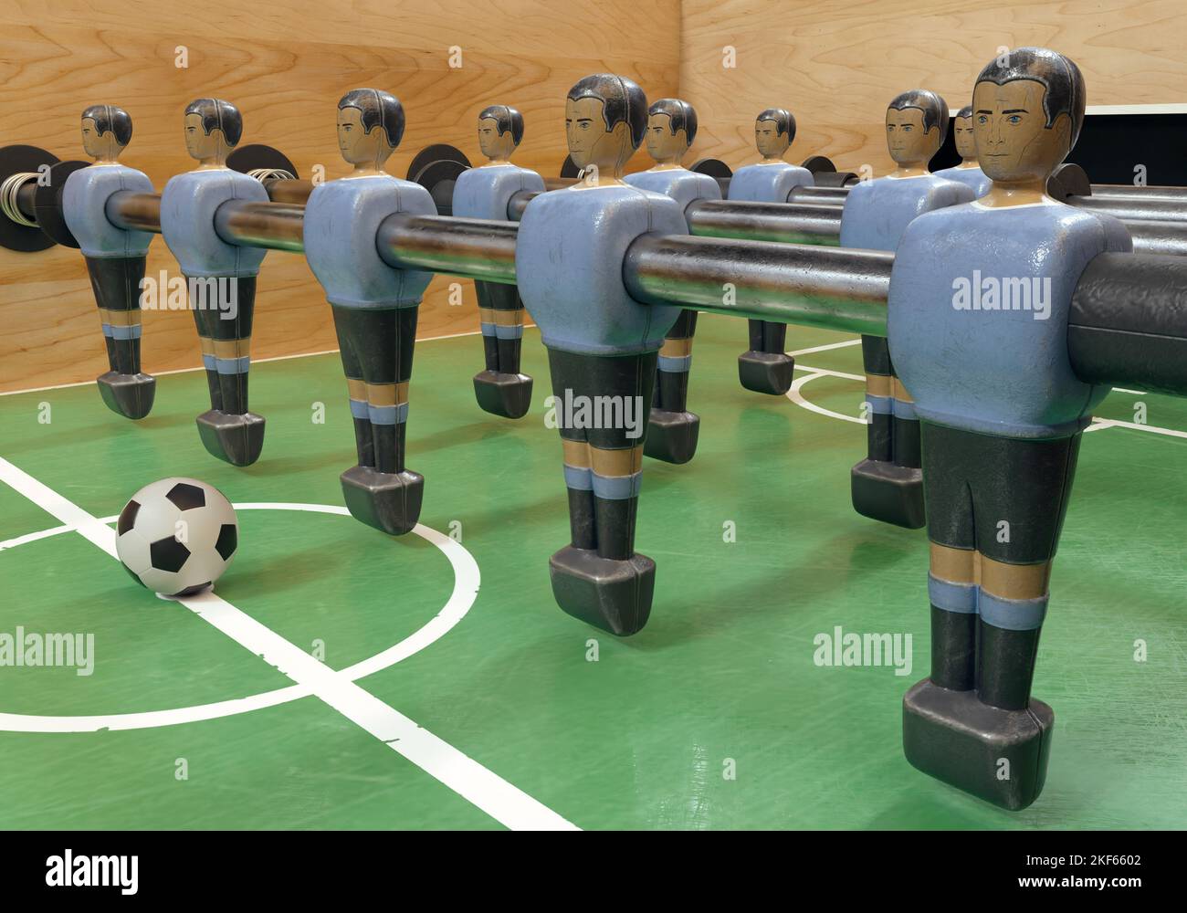 One side of a vintage foosball or table football table with worn metal ...