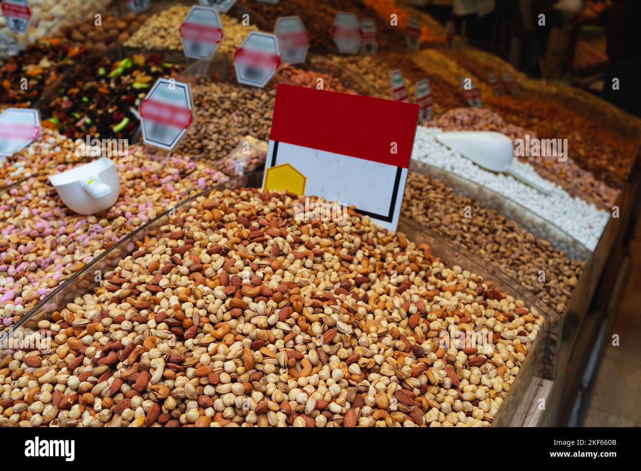 Market stall full of colorful Turkish sweets and nuts Stock Photo - Alamy