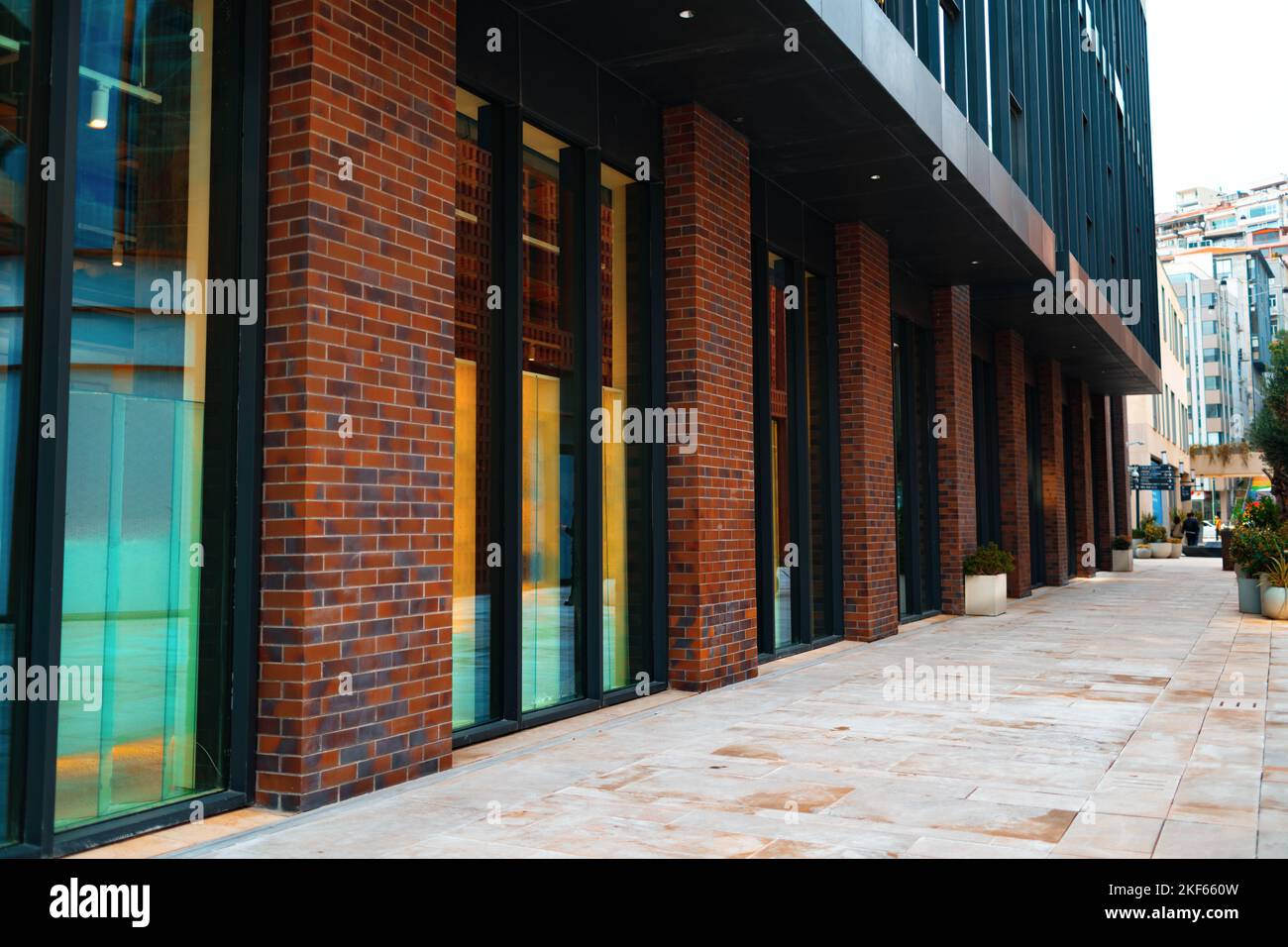 Elegant red brick building with big windows Stock Photo - Alamy