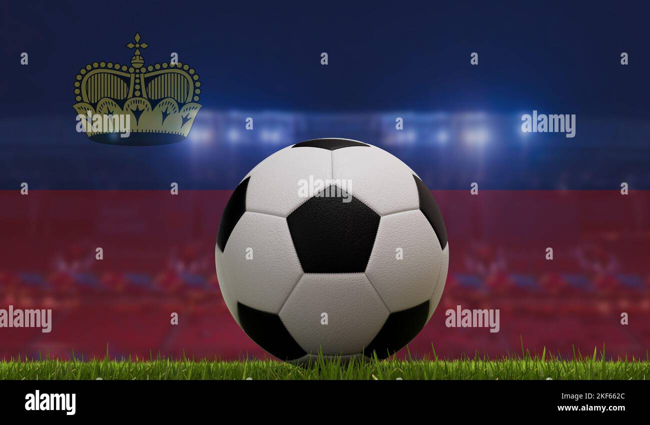 Soccer football ball on a grass pitch in front of stadium lights and ...