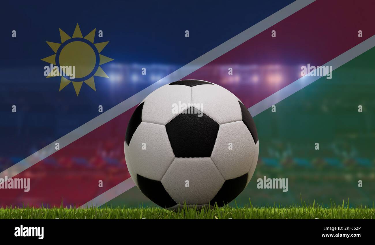 Soccer football ball on a grass pitch in front of stadium lights and ...