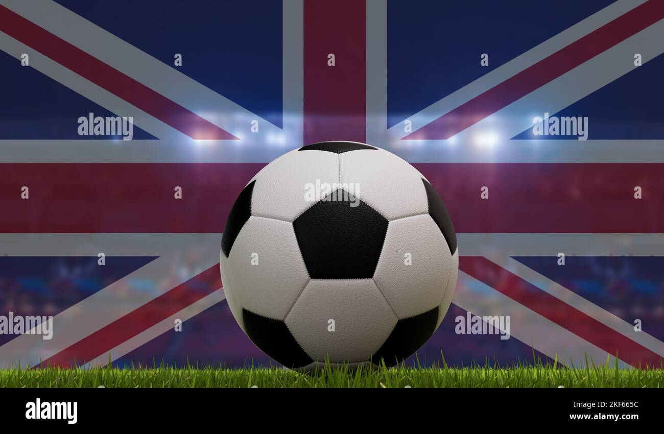 Soccer football ball on a grass pitch in front of stadium lights and UK ...