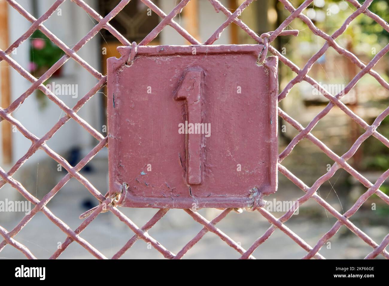 Old retro weathered cast iron plate number 1 closeup Stock Photo - Alamy