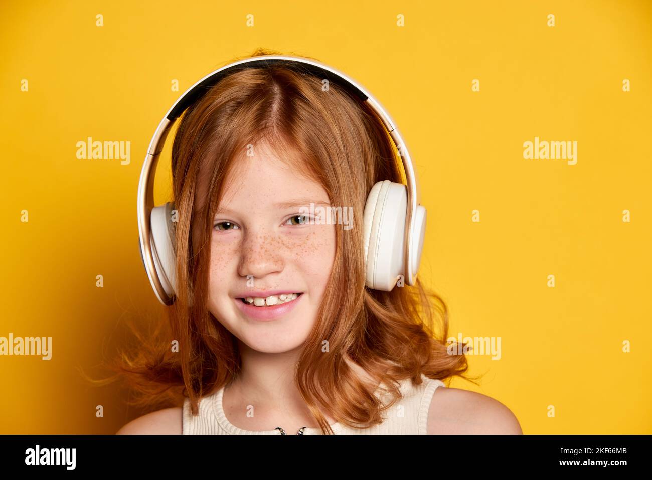 Closeup portrait of little stylish girl with freckles wearing ...