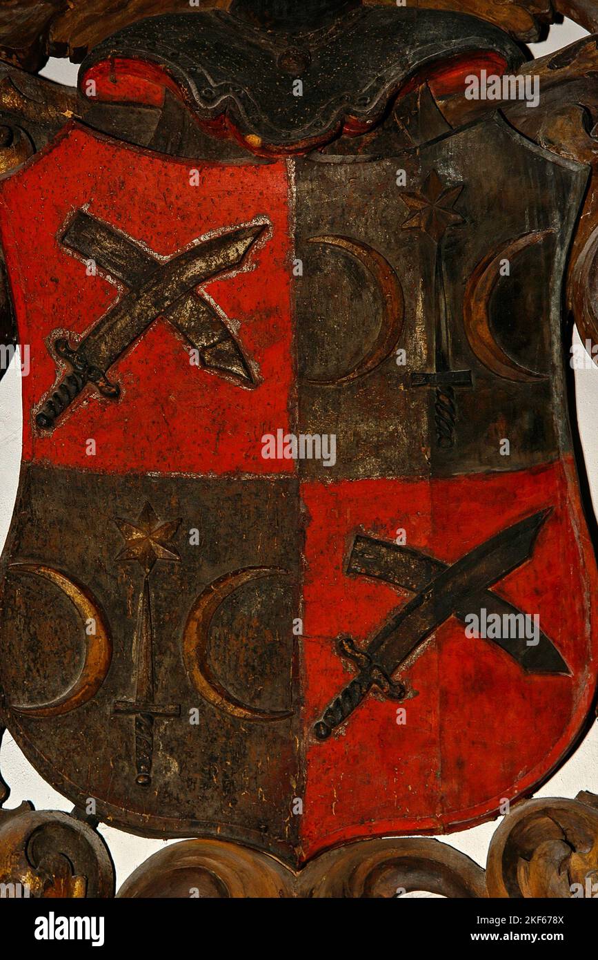 Scimitar swords and crescent moons decorate this shield-of-arms on the ...