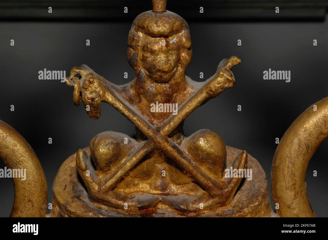 Dusty gilded lion clasps two crossed anchors. On railings around the ...